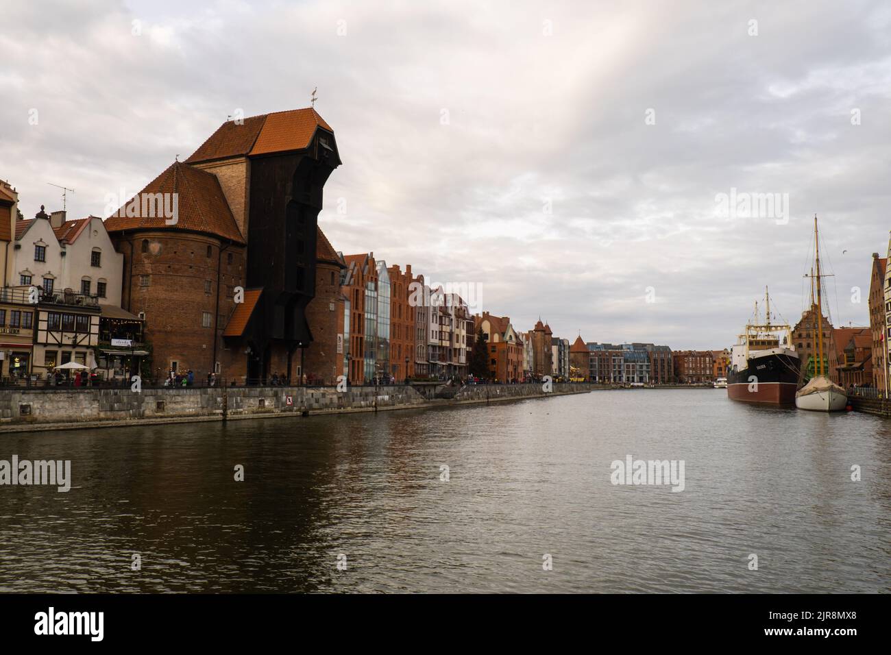 Ancient crane - zuraw Old town in Gdansk. The riverside on Granary ...