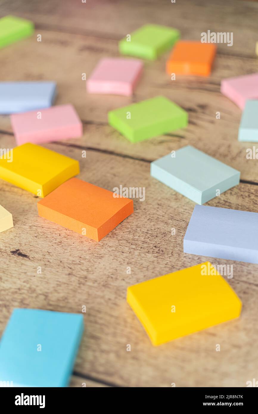 pile of sticky notes on office table at work Stock Photo - Alamy
