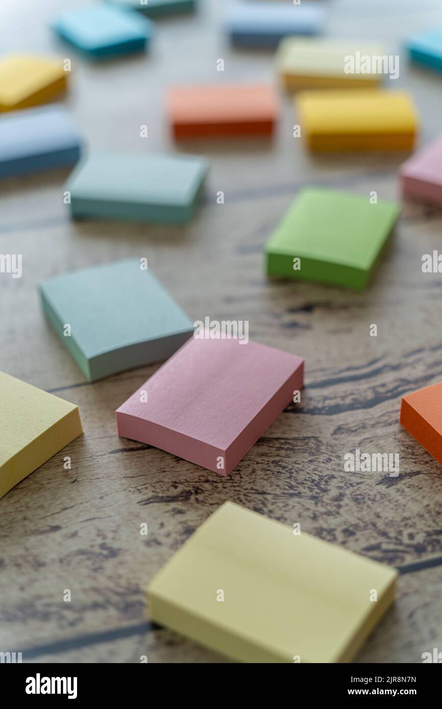 pile of sticky notes on office table at work Stock Photo - Alamy