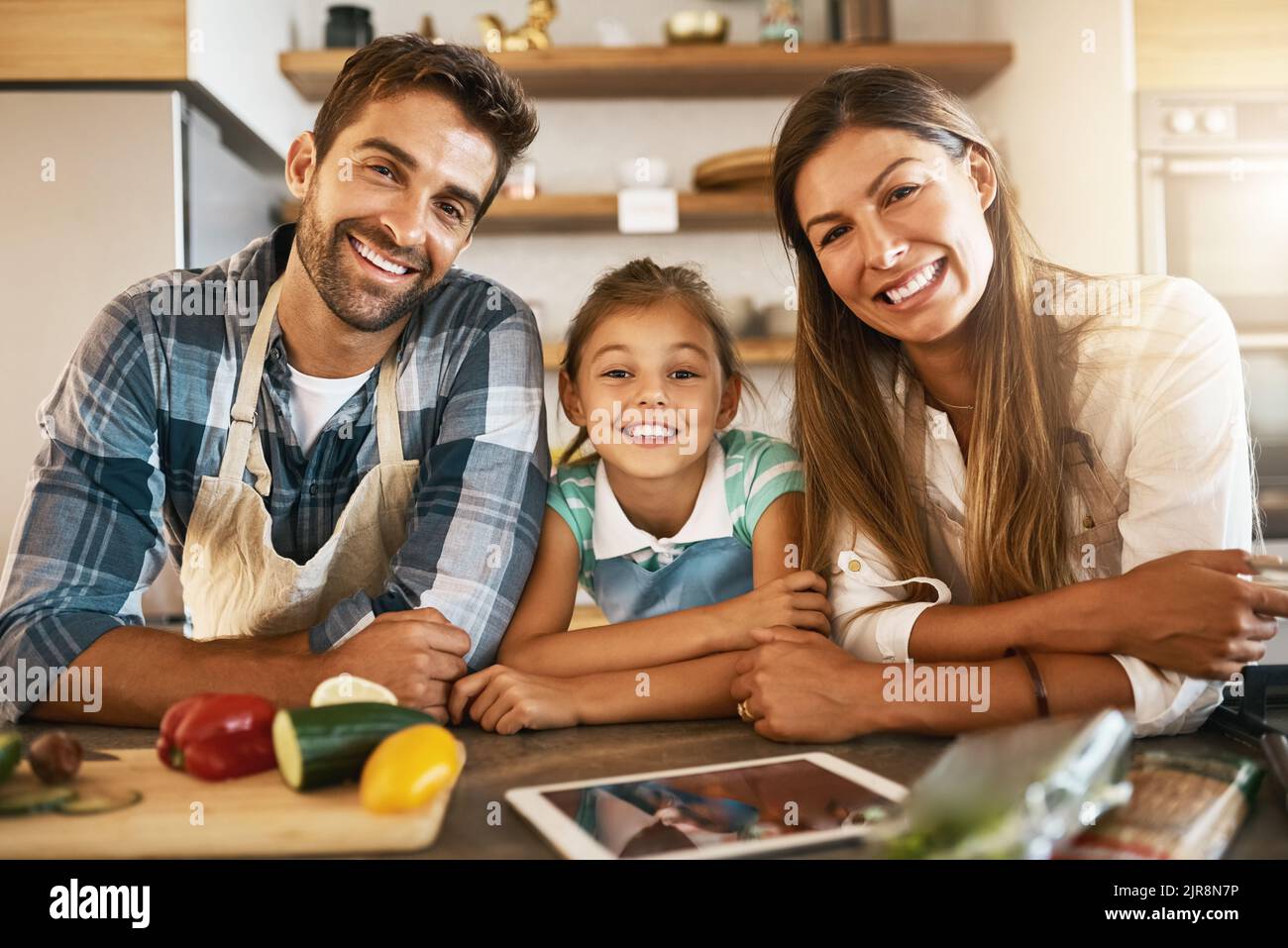 The love of food runs in this family. Portrait of two happy parents and ...