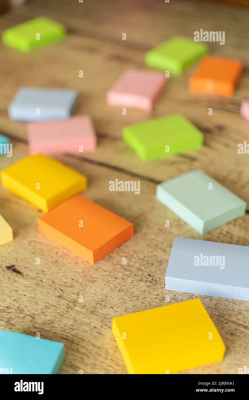 pile of sticky notes on office table at work Stock Photo - Alamy