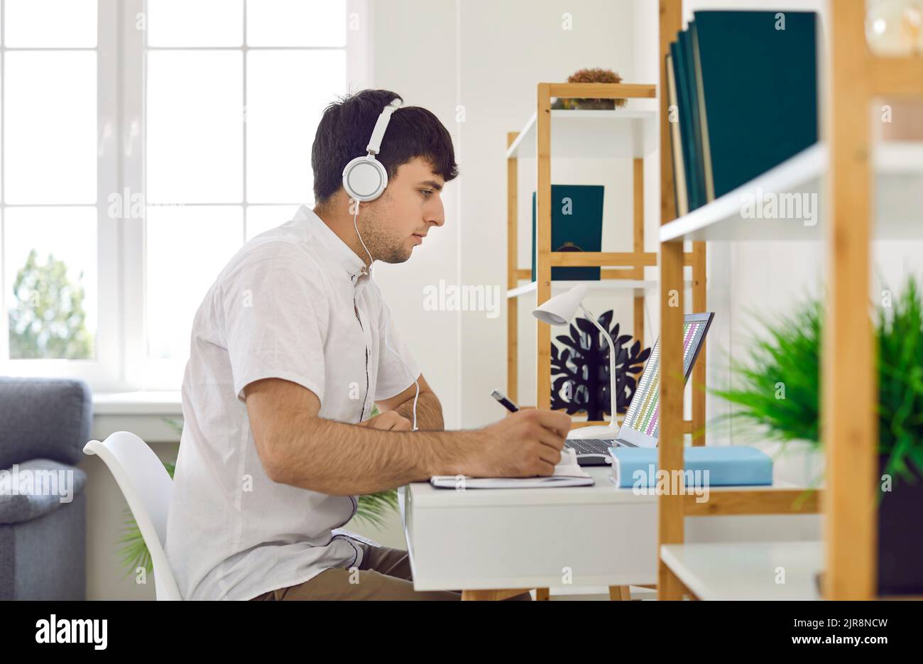 Man headset sitting desk hi-res stock photography and images - Alamy