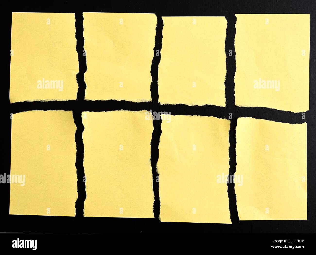 Torn yellow paper on black background Stock Photo - Alamy