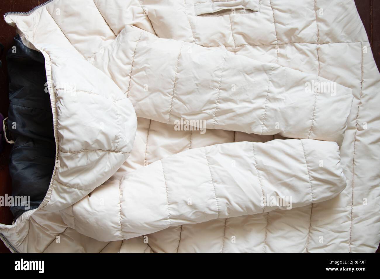 women's padded white soft jacket as background, background of soft ...