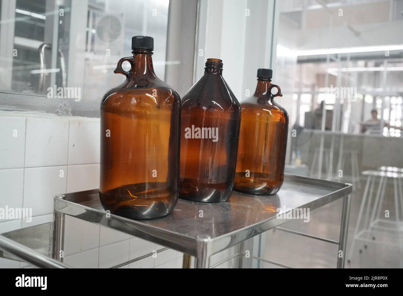 Chemicals in glass containers on table at laboratory Stock Photo - Alamy