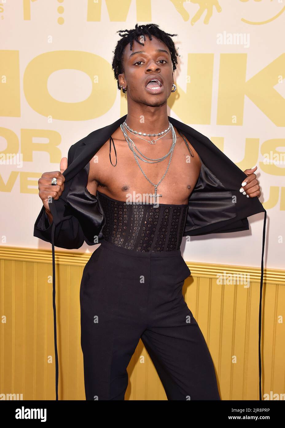 Austin Crute walking the red carpet at the premiere of "Honk For Jesus ...