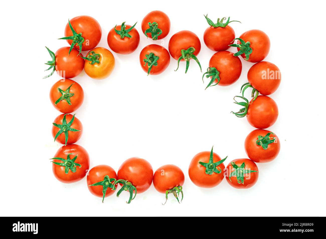 Group of tasty fresh cherry tomatoes arranged in frame shape with copy ...