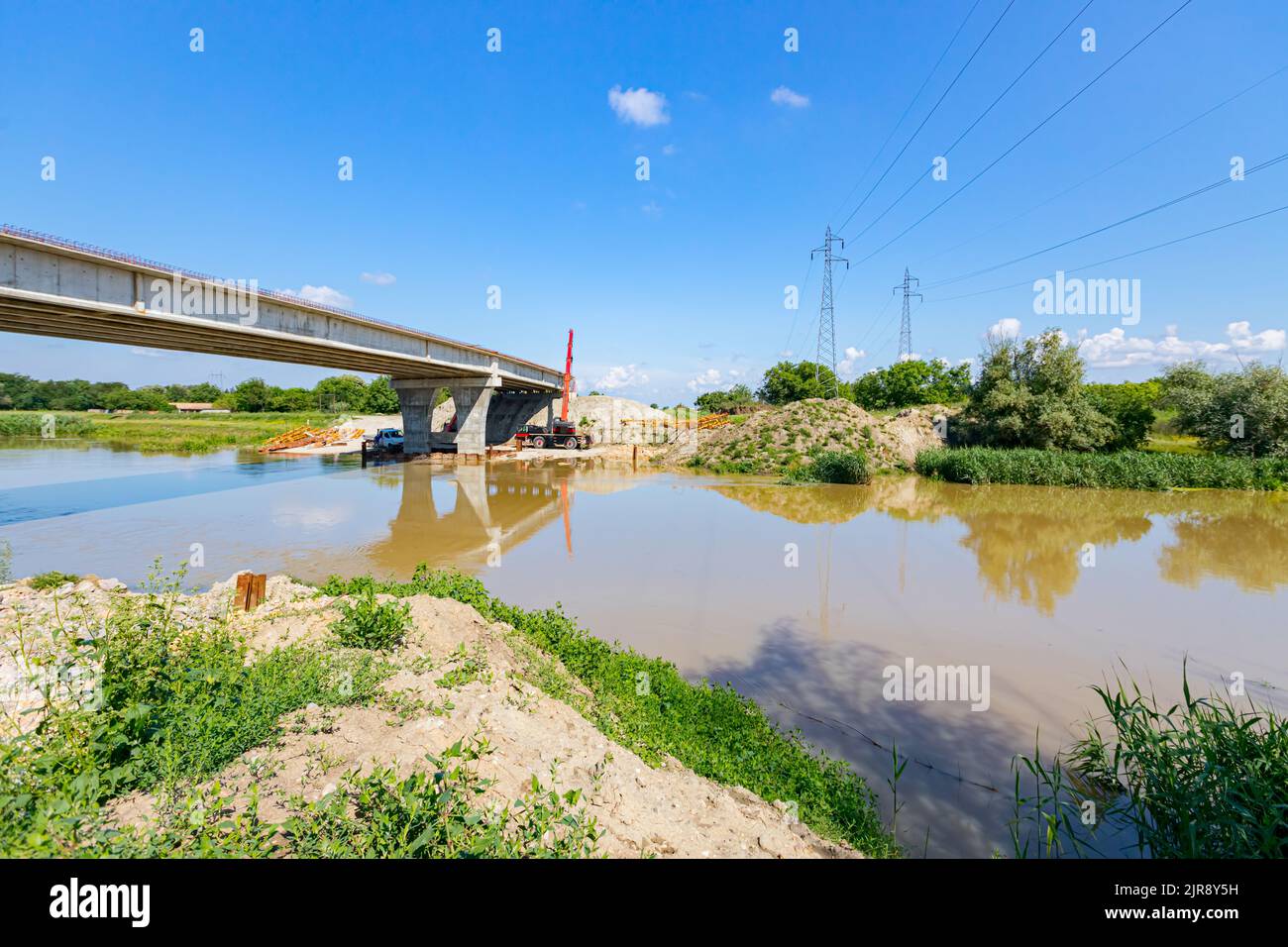 View of the unfinished bridge, road over river is under construction ...