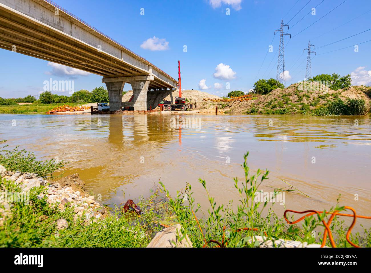 View of the unfinished bridge, road over river is under construction ...