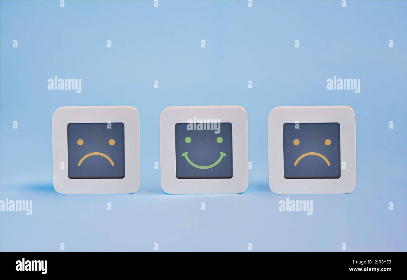 Set of computers with stylized faces of happy and sad faces on lcd ...