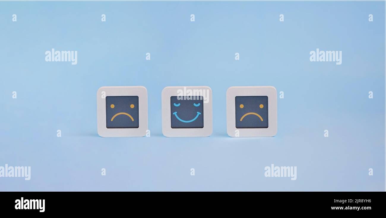 Set of computers with stylized faces of happy and sad faces on lcd ...
