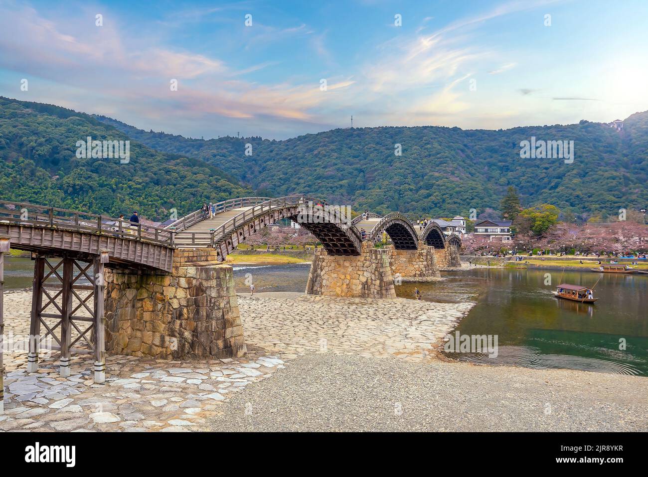 Kintaikyo Bridge in Iwakuni, Japan at sunset with cherry blossom Stock ...