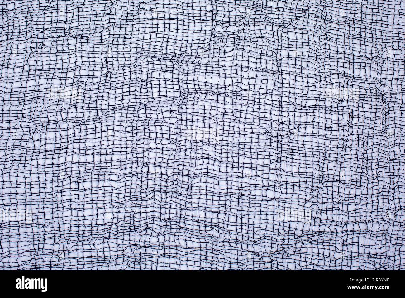 Black textile mesh on white background. Fabric, cobweb, background ...