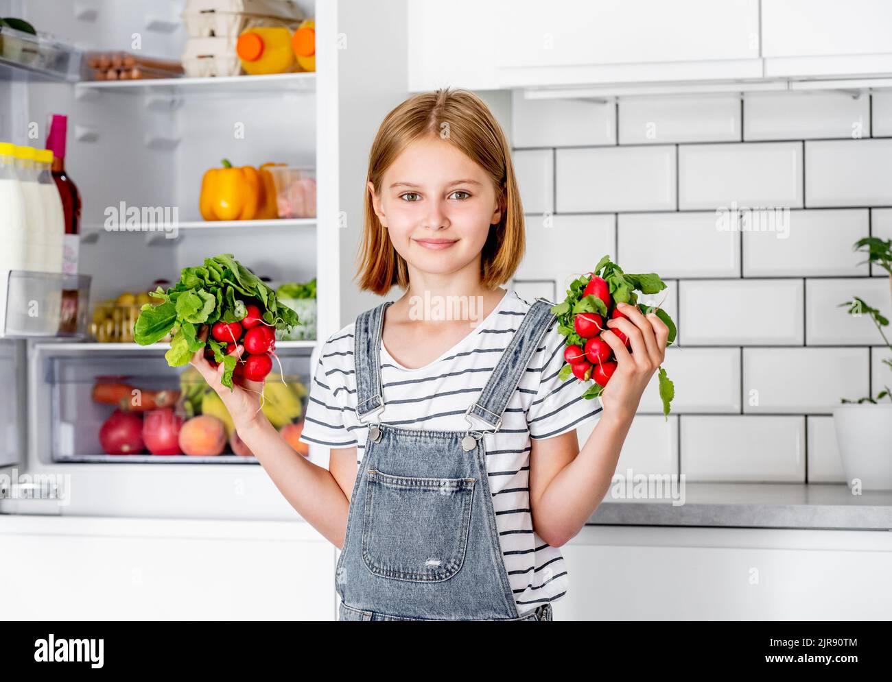 Preteen girl at kitchen Stock Photo - Alamy