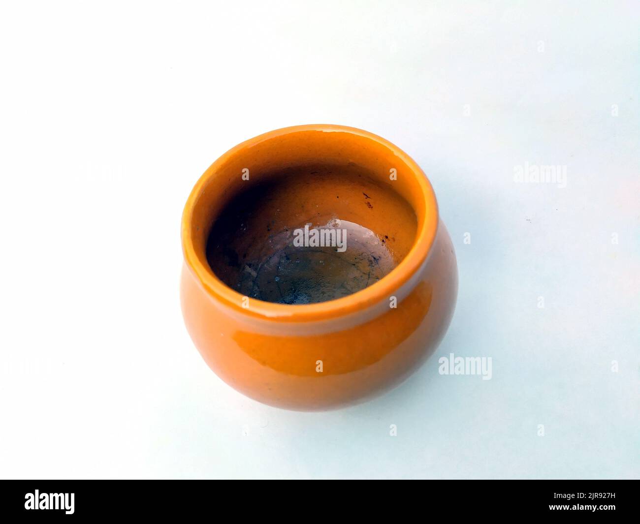 Brown clay pot isolated on white background Stock Photo - Alamy