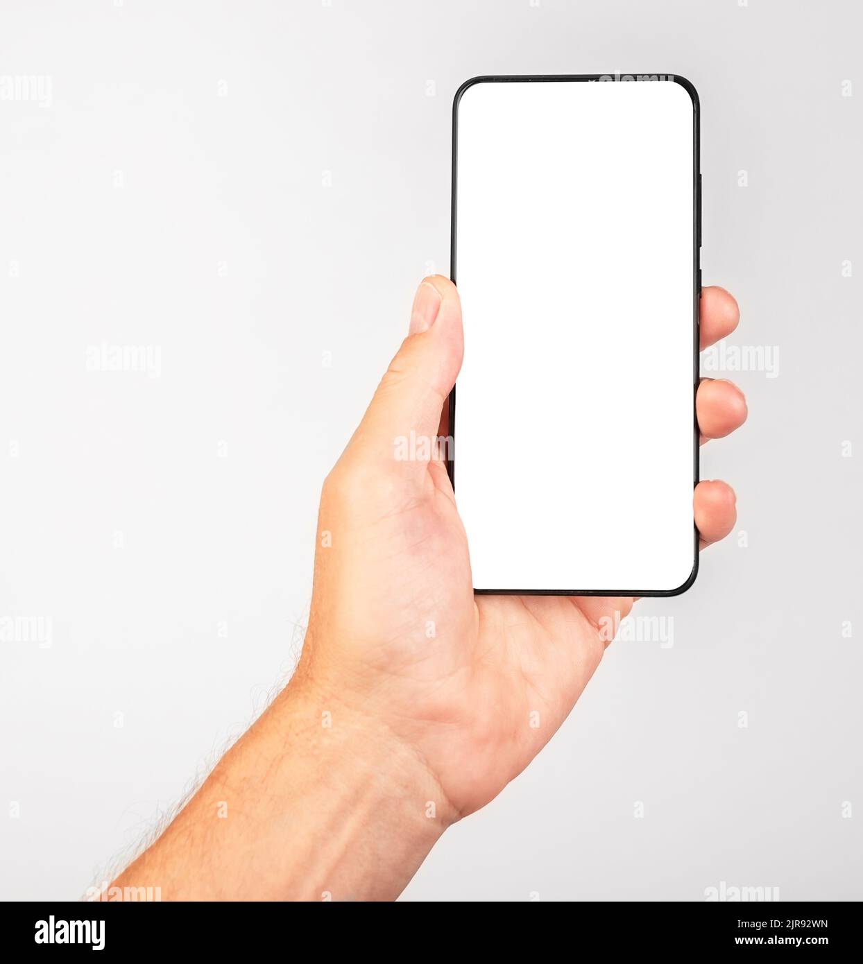 Hand holding smartphone in vertical position. Woman using for taking ...