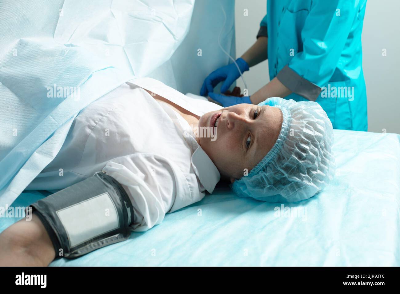 Female patient in operating room at hospital, ready to cesarean section ...