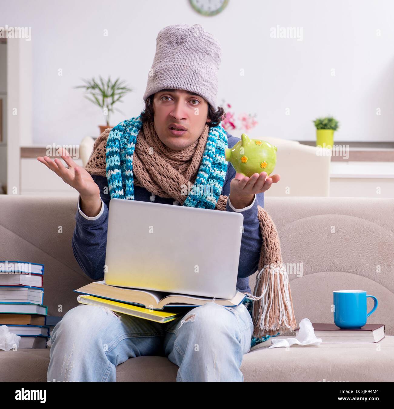 The sick male student suffering at home Stock Photo - Alamy