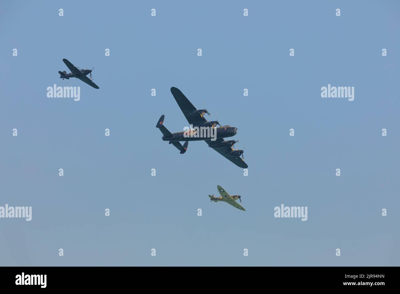 Battle of Britain Memorial Flight. Lancaster, Spitfire and Hurricane aircraft flying over Sussex ...