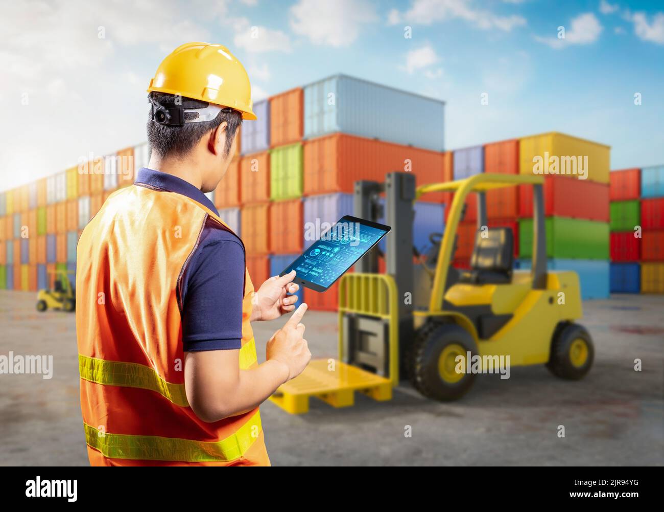 Engineer or asian worker work with tablet at container terminal Stock ...