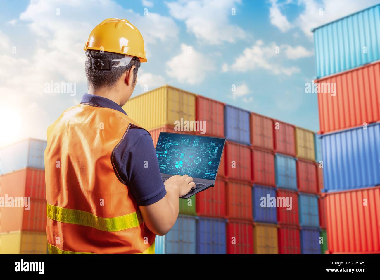 Engineer or asian worker work with computer notebook at container ...