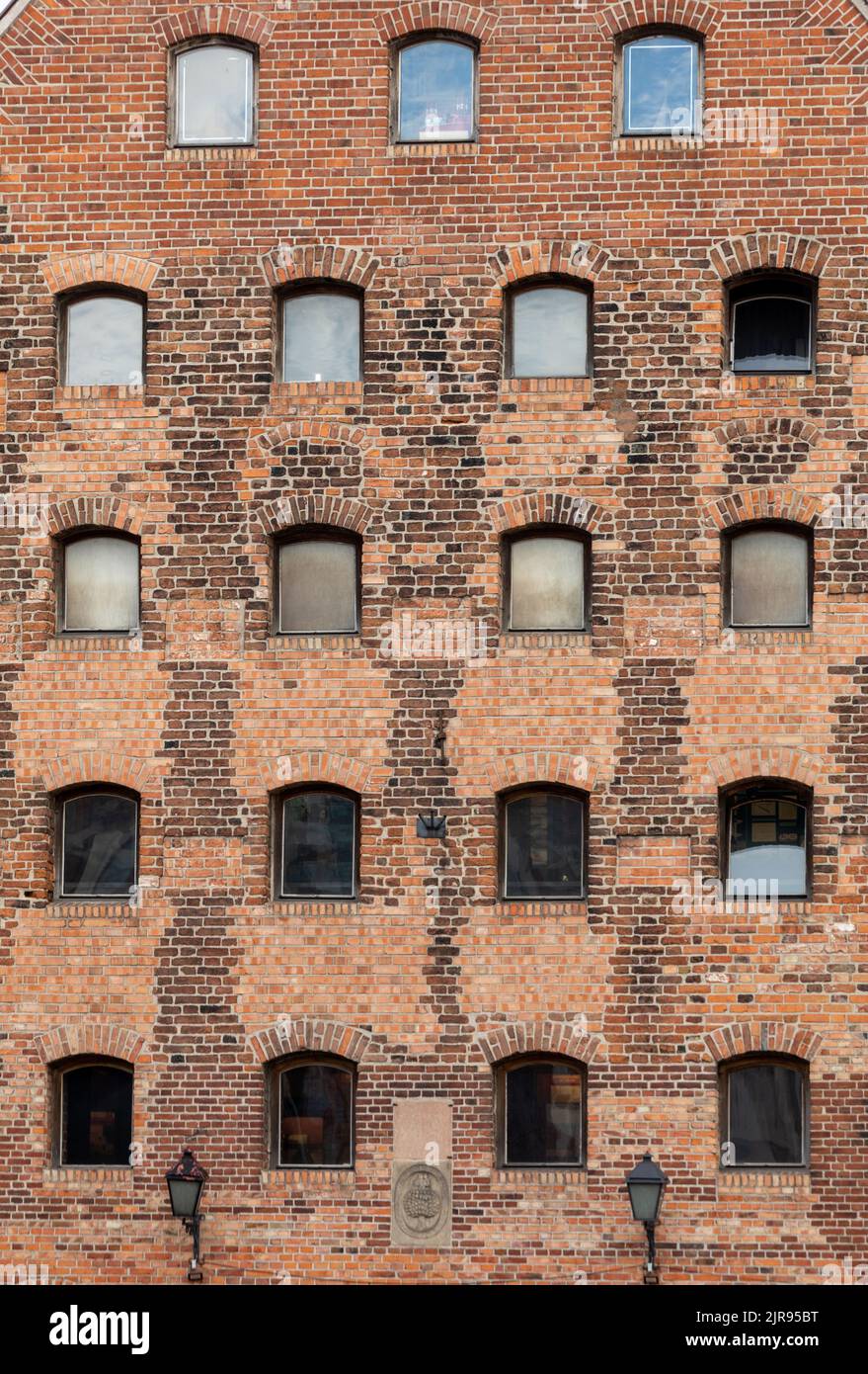 Facade of restored medieval granary on the Granary island in the old ...