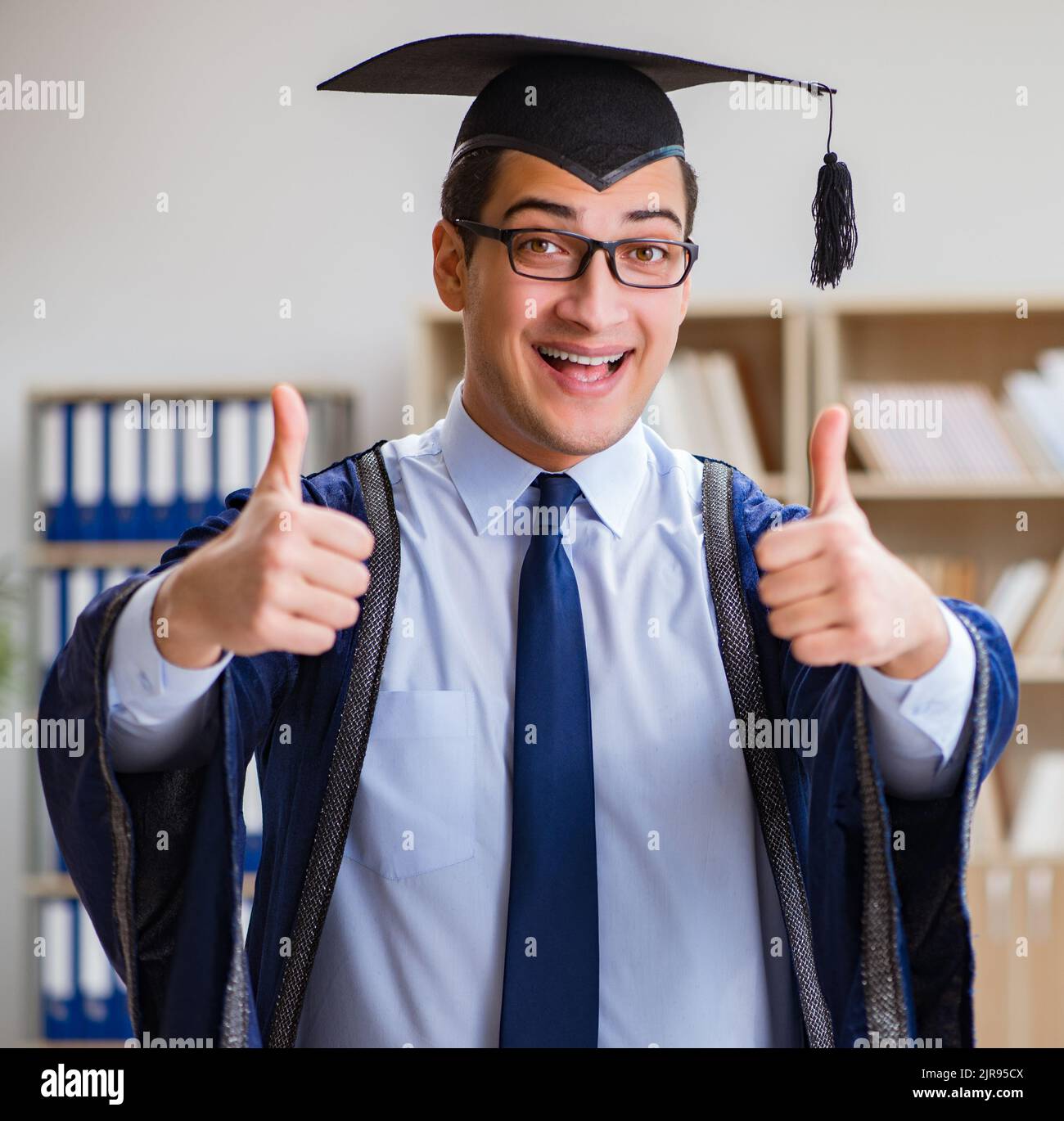 The young man graduating from university Stock Photo - Alamy