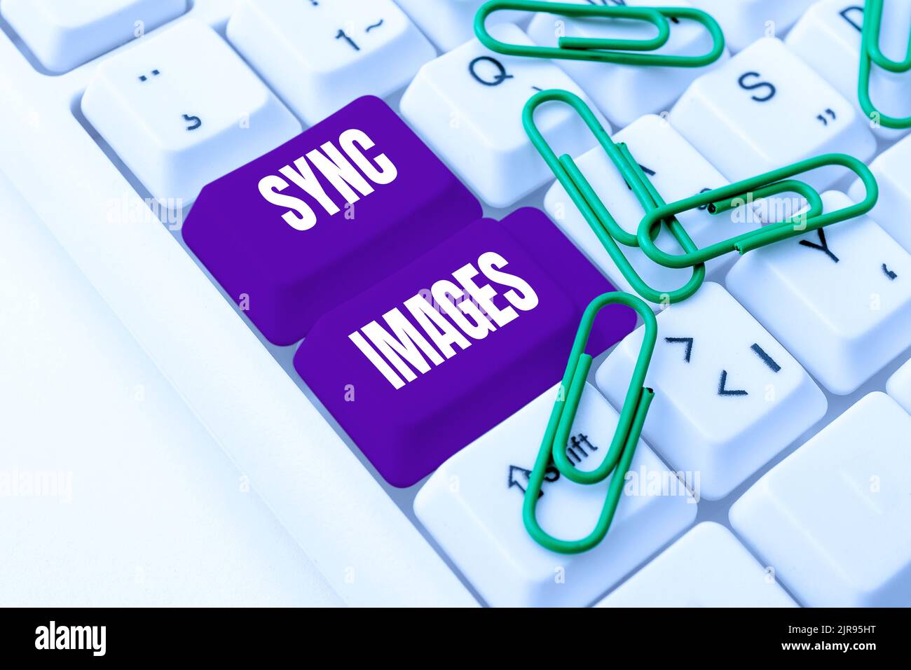 Hand writing sign Sync Images. Concept meaning Making photos identical ...