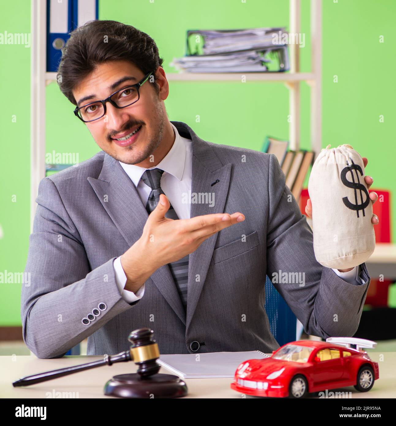 The young handsome lawyer working in the office Stock Photo - Alamy