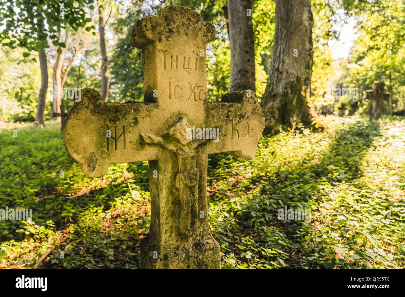 Abandoned greveyard from 1800s. Close up of headstone in the shape of a ...