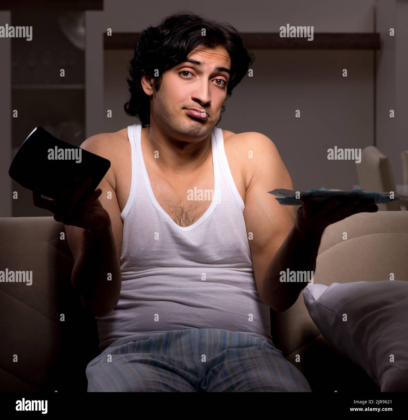 Young man calculating expences hi-res stock photography and images - Alamy