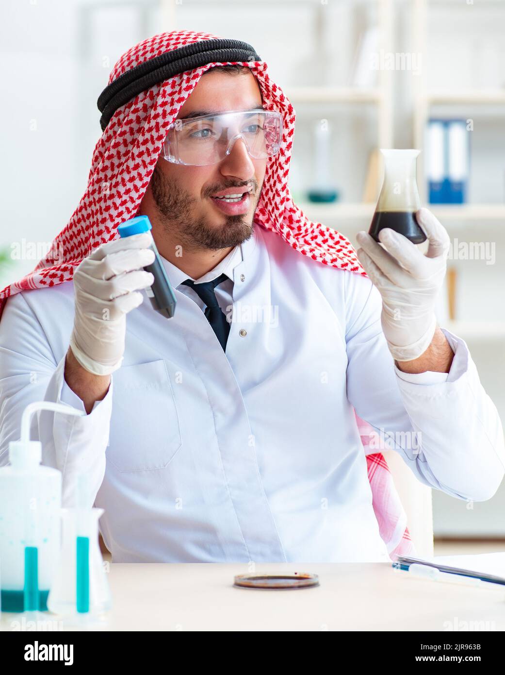 The arab chemist scientist testing quality of oil petrol Stock Photo ...