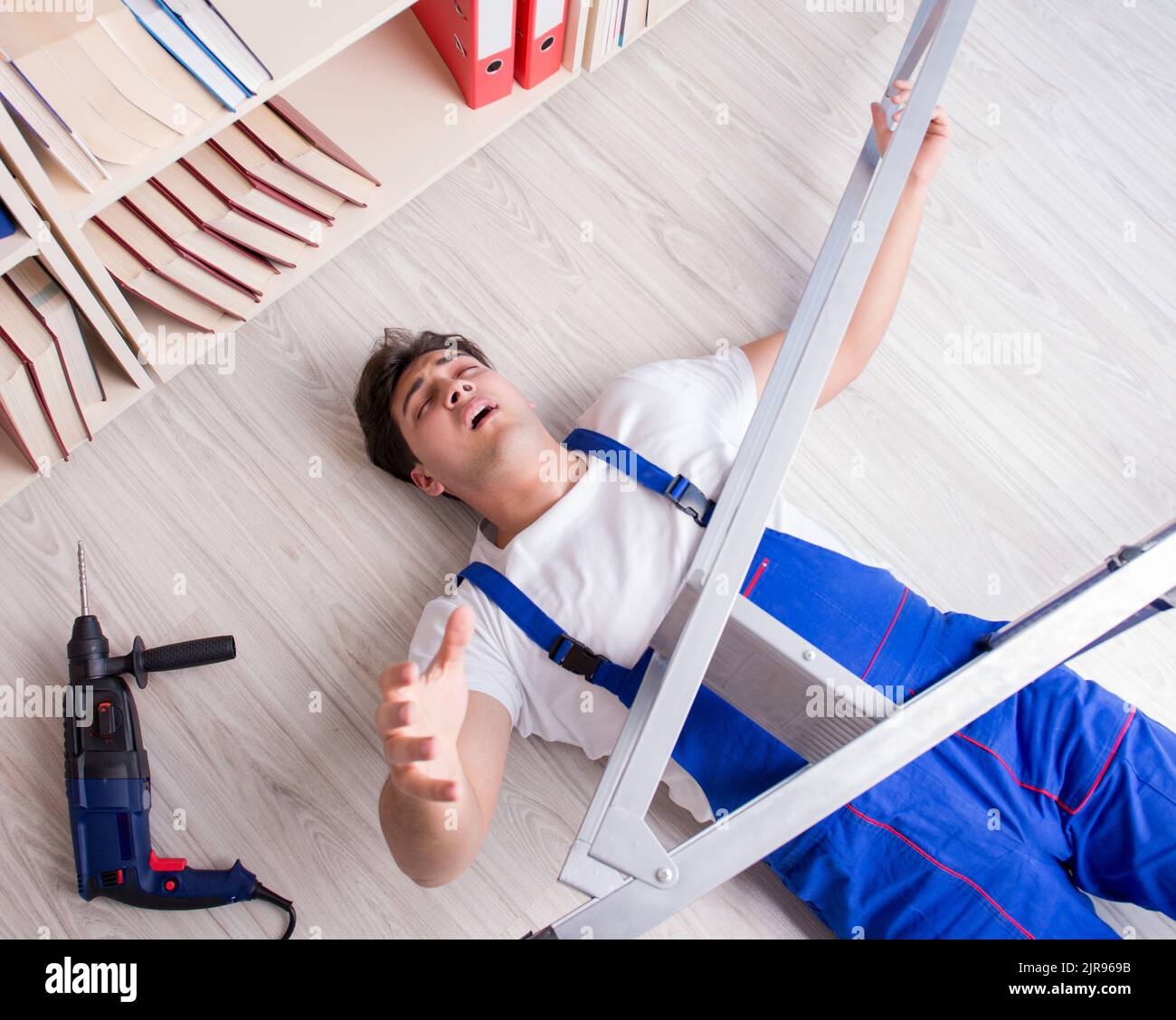 The unsafe behavior concept with falling worker Stock Photo - Alamy