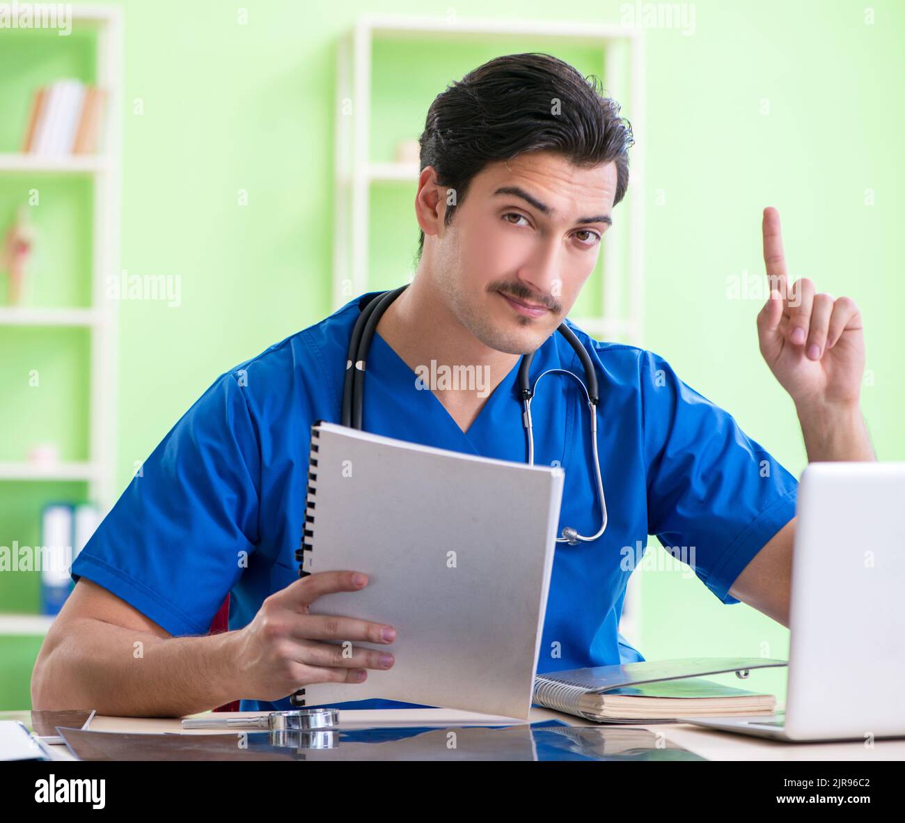 The young doctor working in the hospital Stock Photo - Alamy