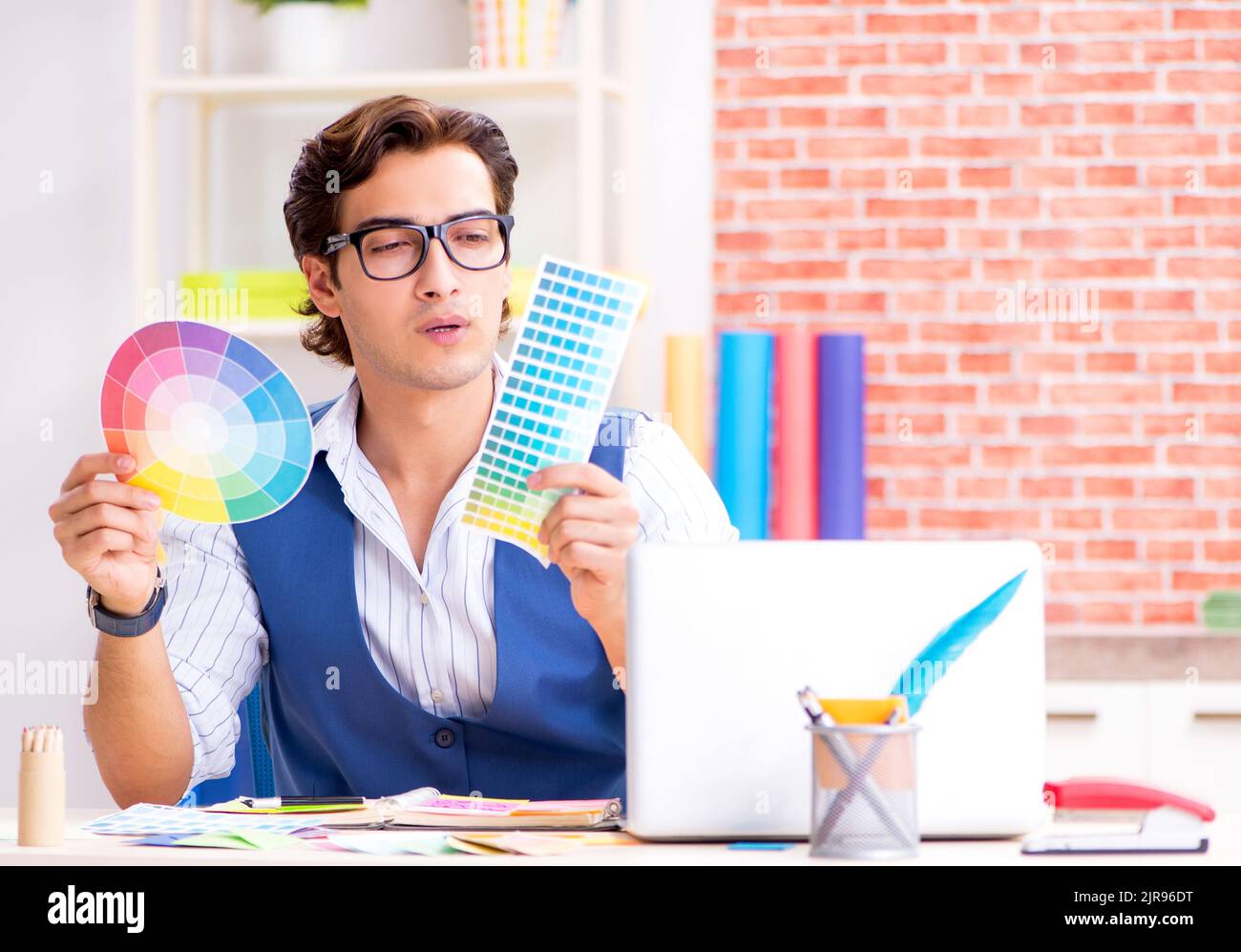 Young designer freelancer working on new project Stock Photo - Alamy