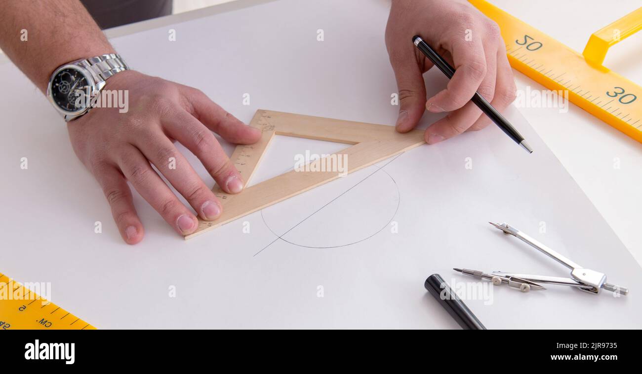 The male engineer working on drawings and blueprints Stock Photo - Alamy