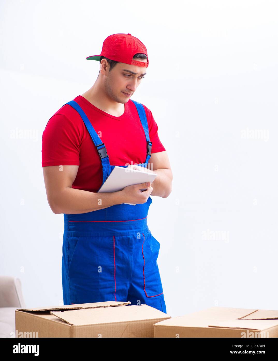 The contractor worker moving boxes during office move Stock Photo - Alamy