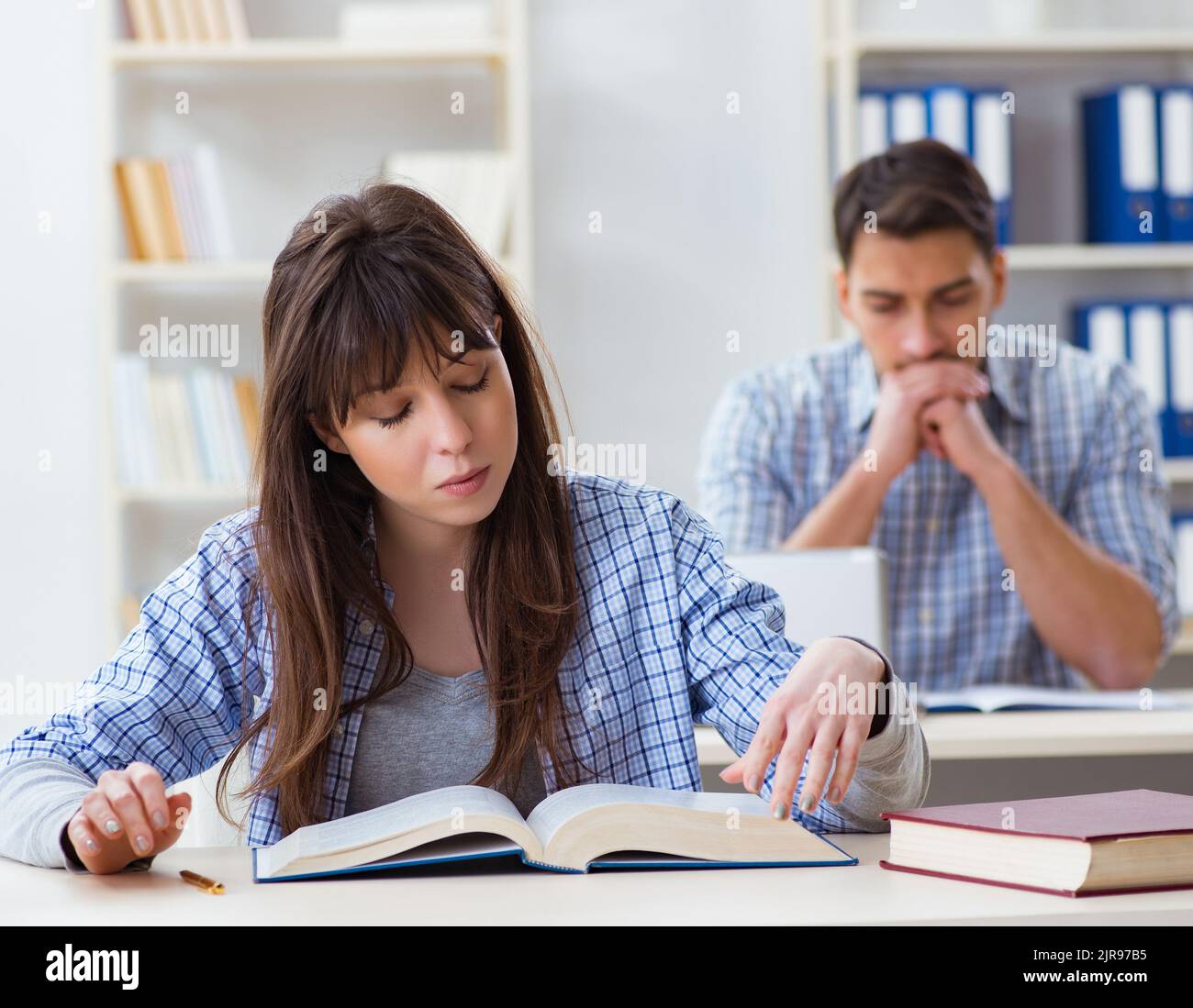 The students sitting and studying in classroom college Stock Photo - Alamy
