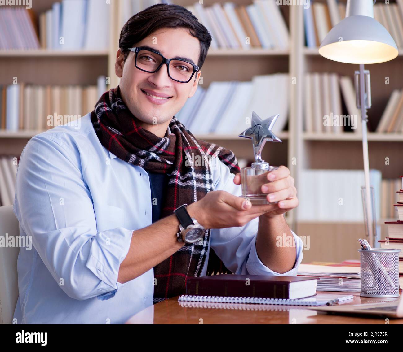 The young writer working in the library Stock Photo - Alamy