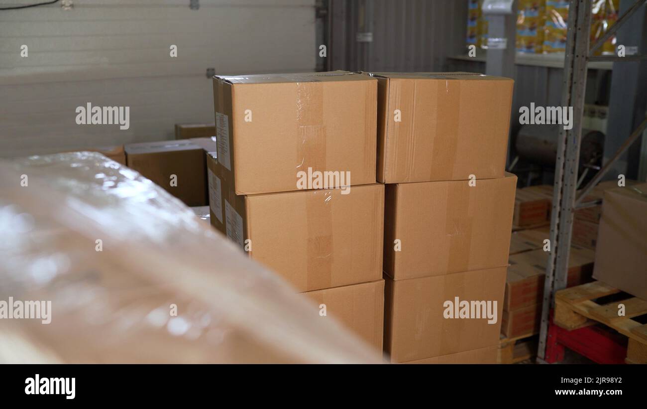 Cardboard boxes available, delivery. Warehouse interior, packing boxes ...
