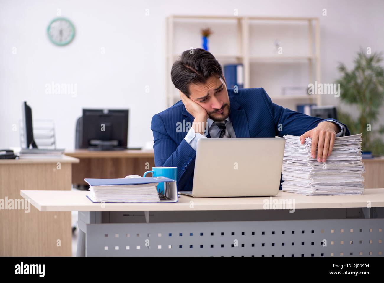 Young businessman employee working at workplace Stock Photo - Alamy