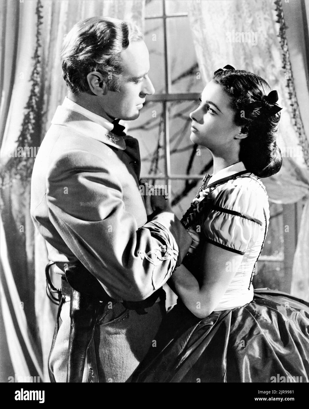 LESLIE HOWARD as Ashley Wilkes and VIVIEN LEIGH as Scarlett O'Hara in GONE WITH THE WIND 1939 ...