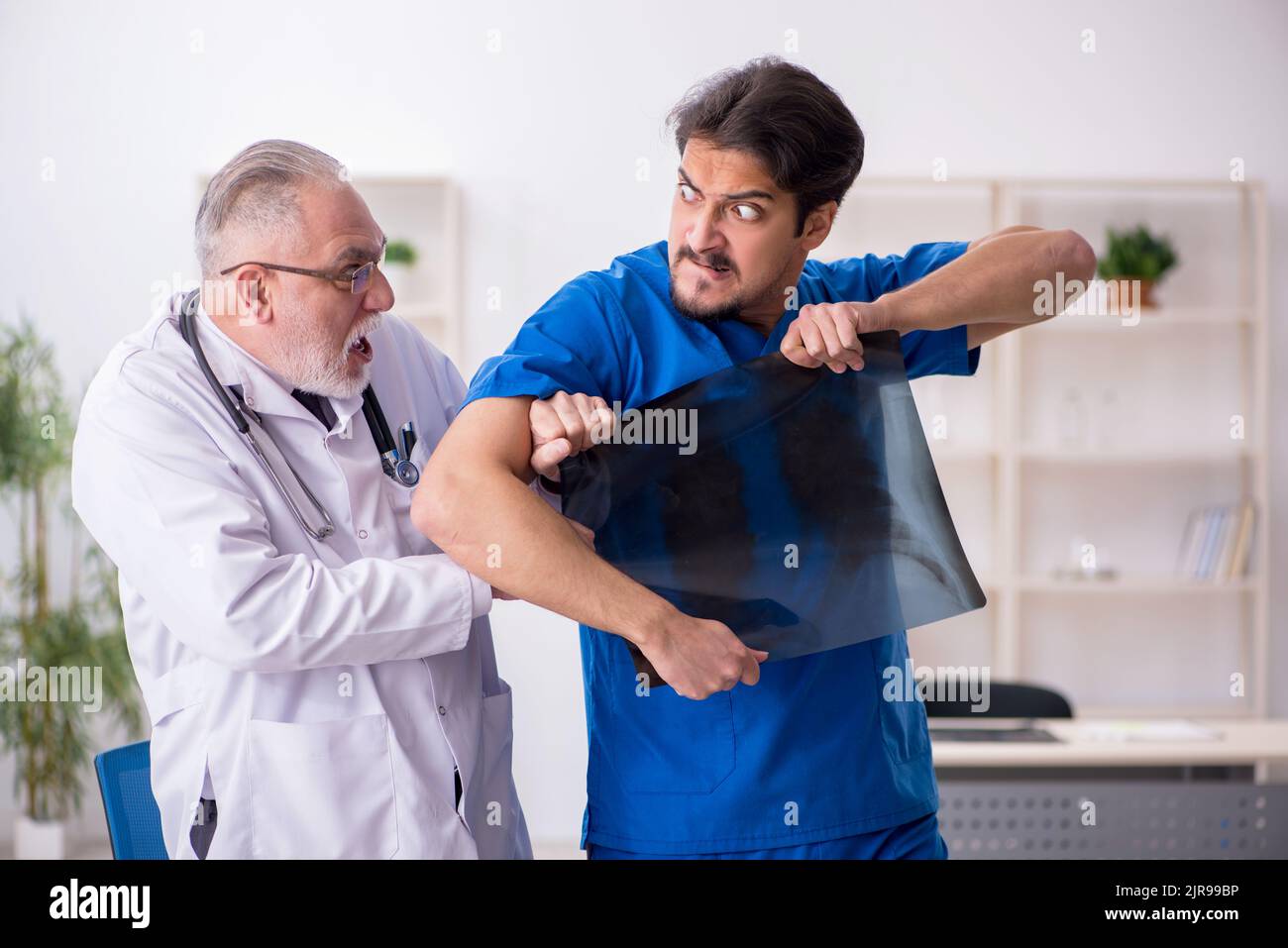 Two doctors working in the clinic Stock Photo - Alamy