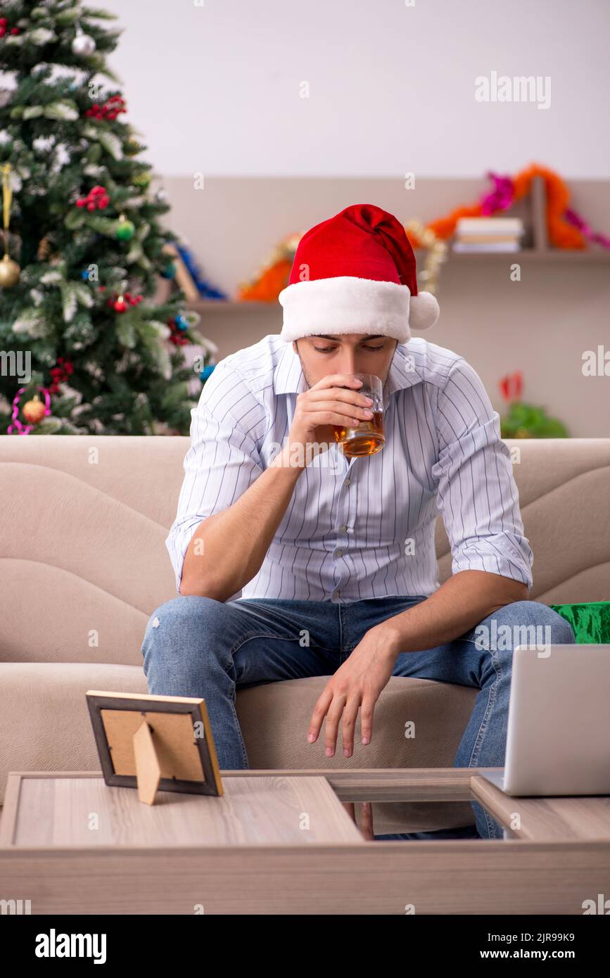 Young man celebrating New year at home alone Stock Photo - Alamy