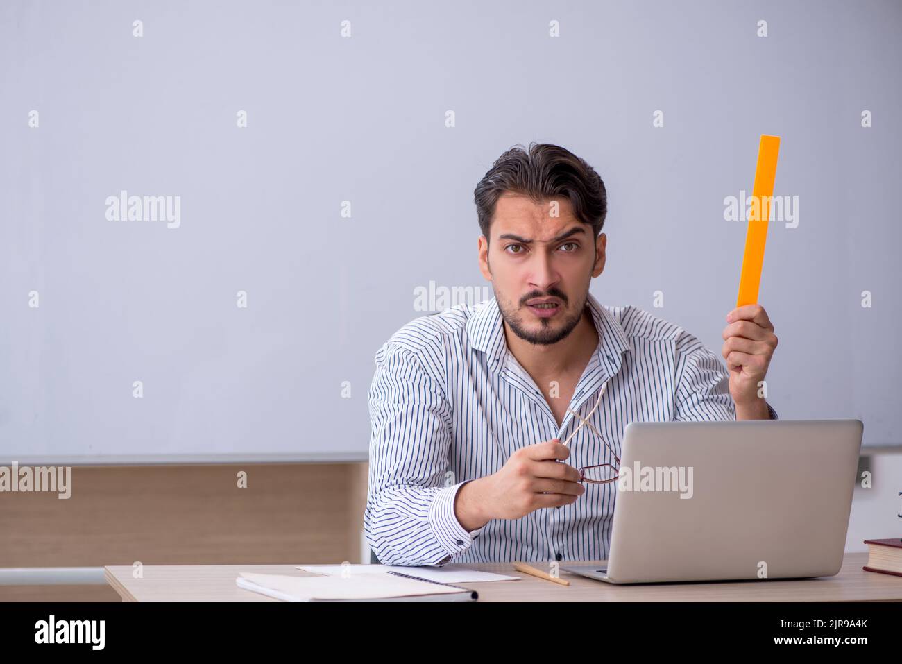 Angry teacher and ruler hi-res stock photography and images - Alamy
