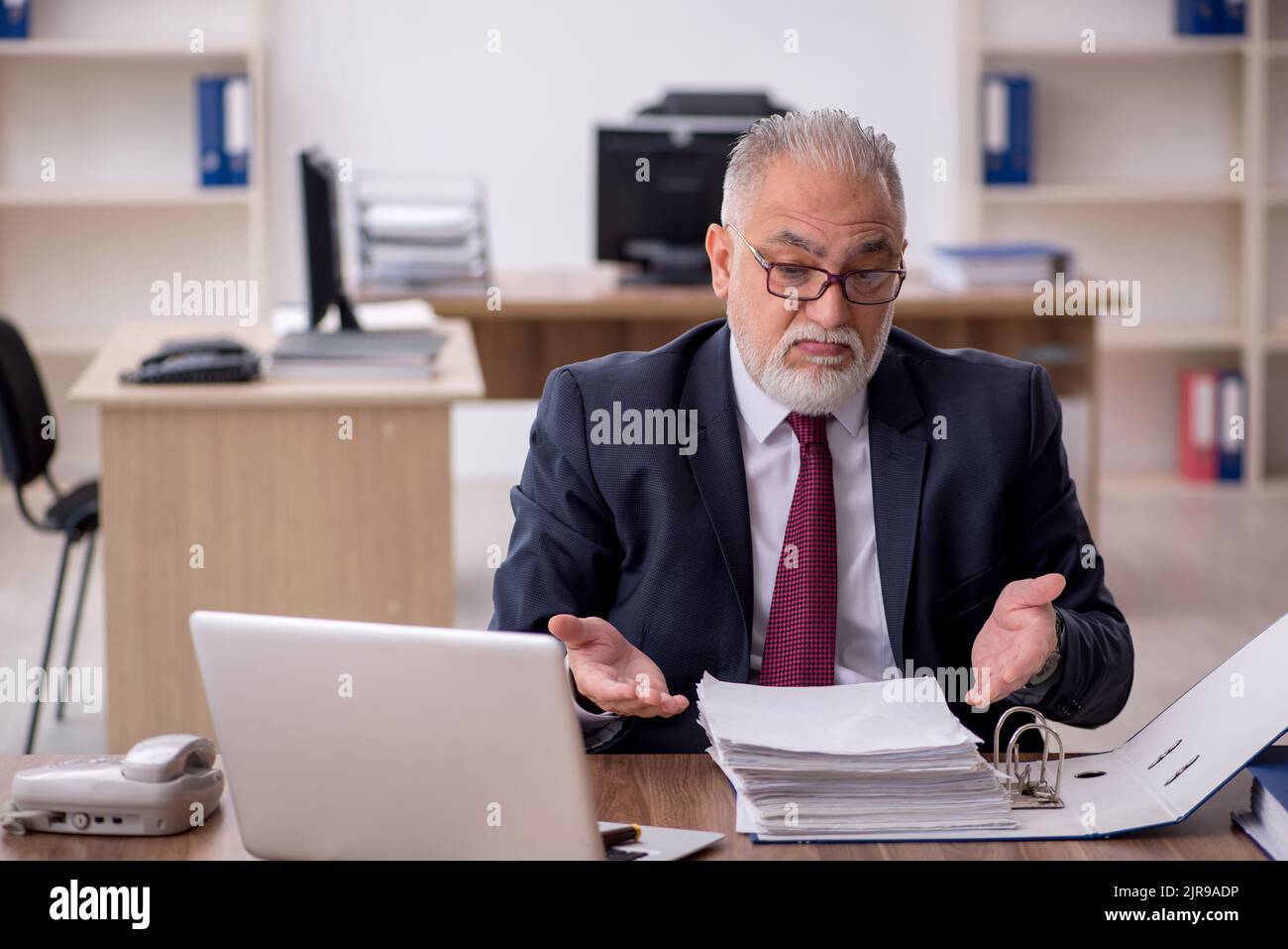 Old businessman employee working in the office Stock Photo - Alamy