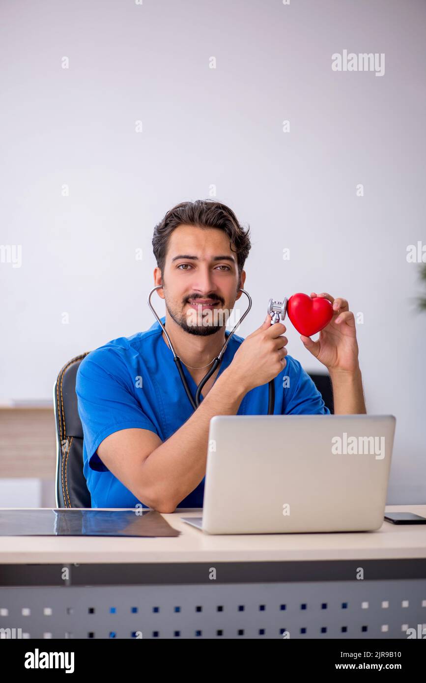 Young doctor cardiologist working at the hospital Stock Photo - Alamy
