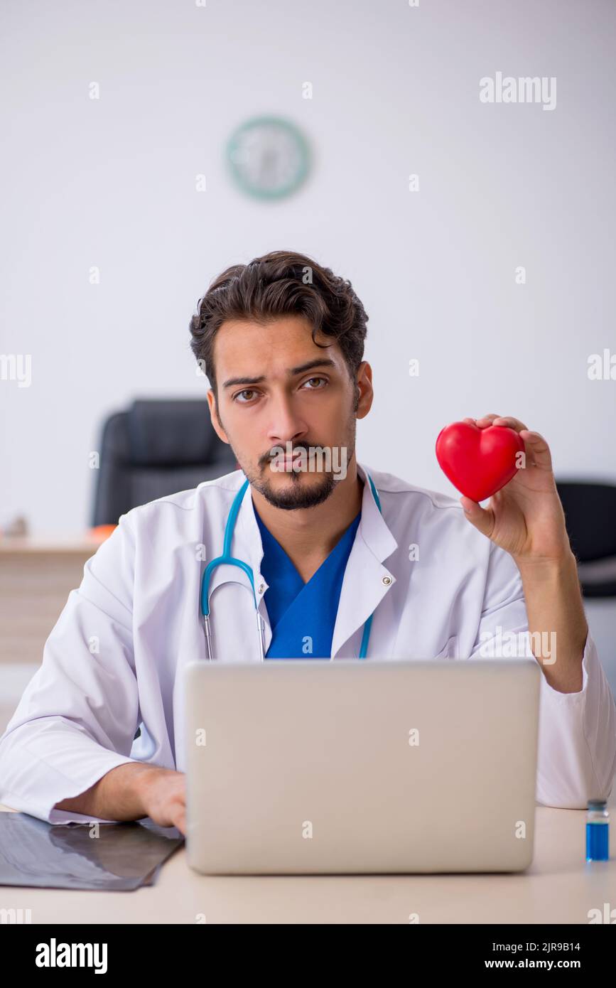 Young doctor cardiologist working at the hospital Stock Photo - Alamy