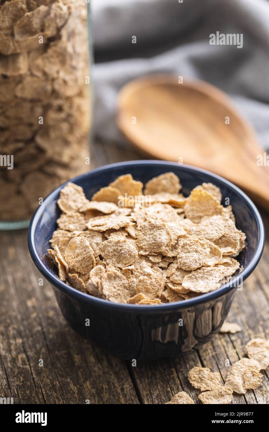 Whole grain cereal flakes. Wholegrain breakfast cereals in bowl on a ...