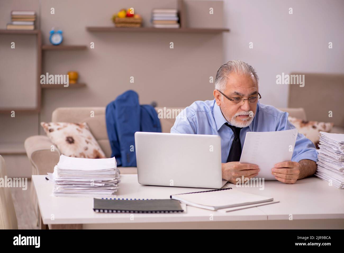 Old boss working from home during pandemic Stock Photo - Alamy
